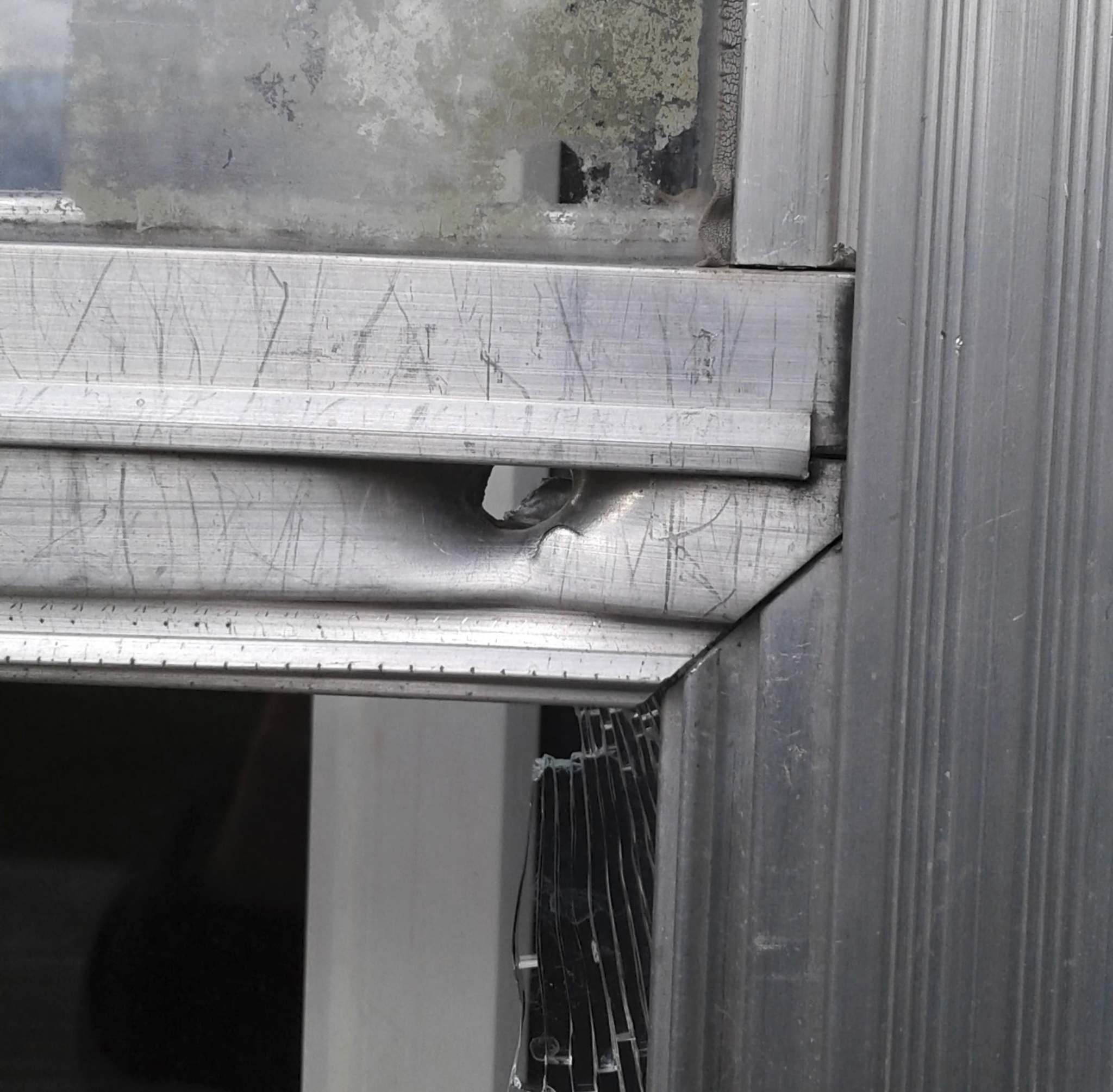 Bullet goes through window – Brandon Sun