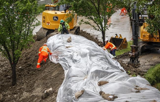 Calgary to keep flood protections in place as it monitors storm ...