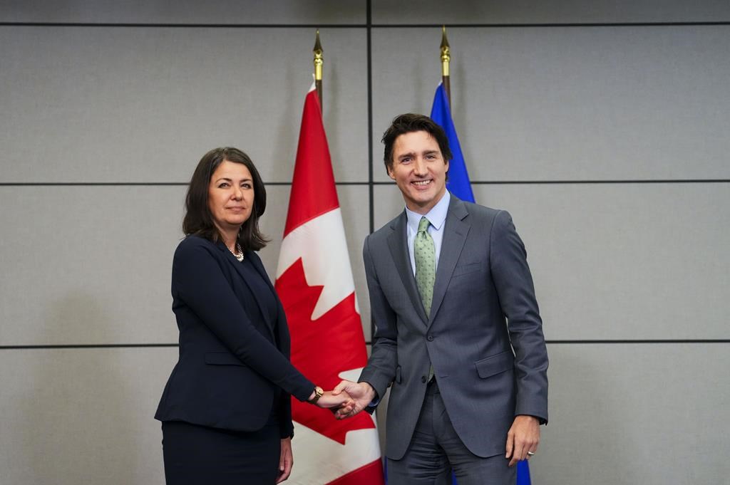 Alberta Premier Smith meets Prime Minister Trudeau; awkward handshake ...
