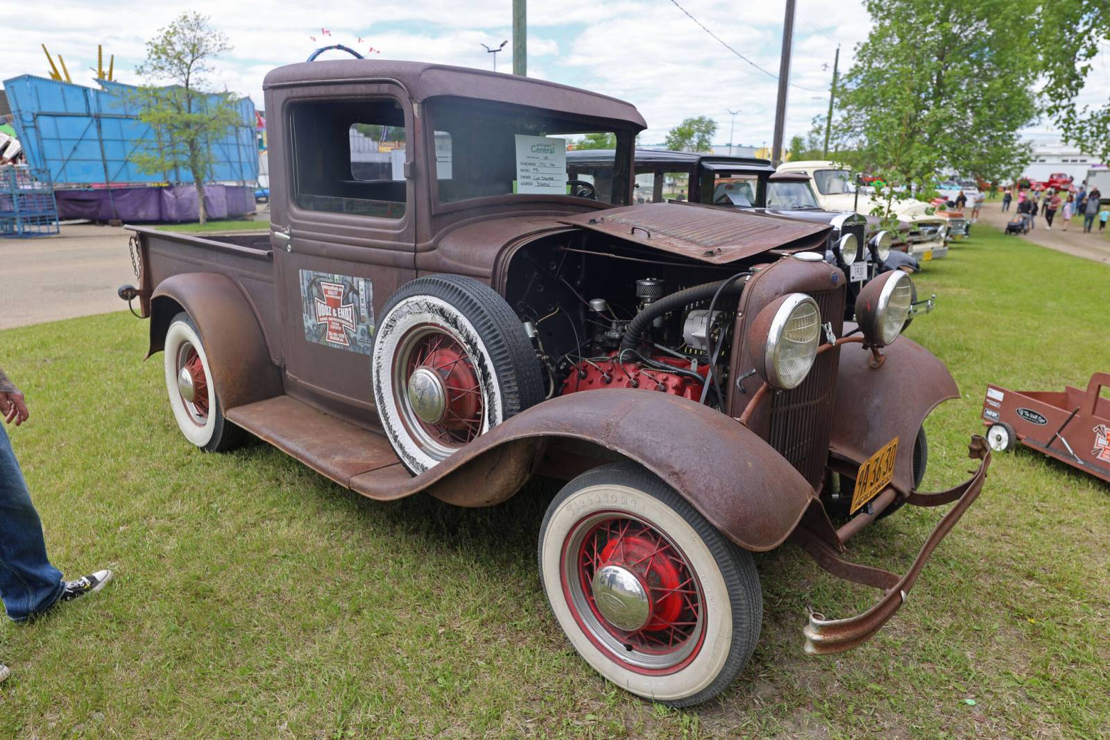 Cars shine under the trees – Brandon Sun