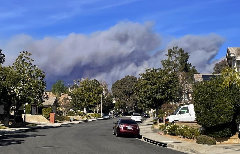 Over 50,000 under evacuation orders or warnings as wildfire imperils ...
