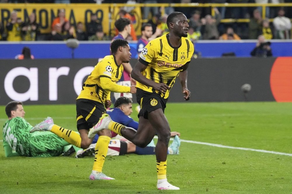 Guirassy scores a hat trick in vain for Dortmund as Barcelona advances ...